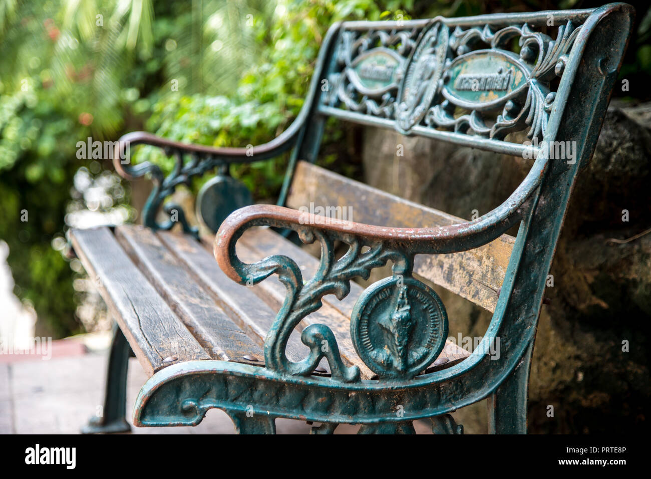 beautiful retro bench with wrought-iron lace handles Stock Photo - Alamy