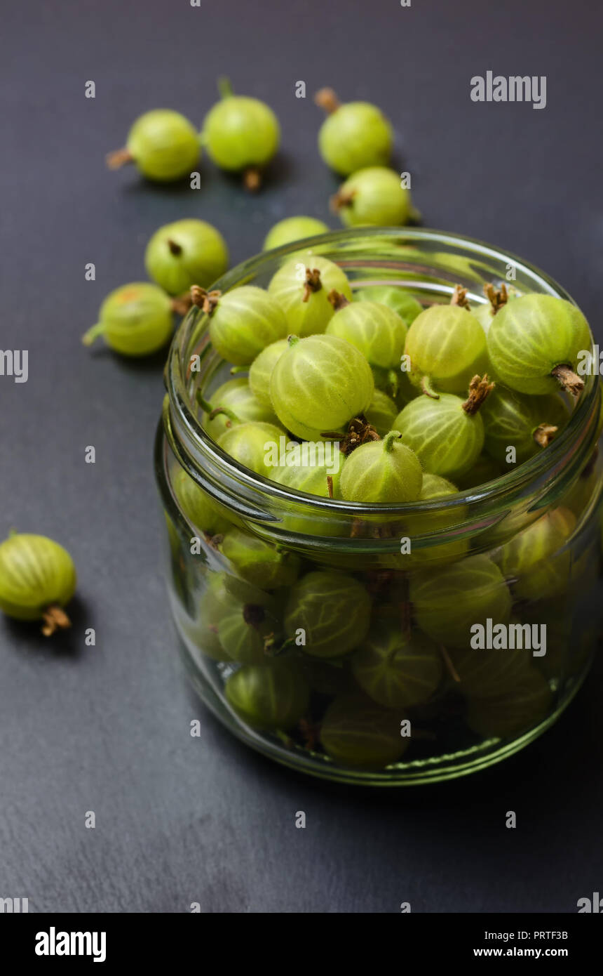 Gooseberry in glass jar on a table Stock Photo - Alamy