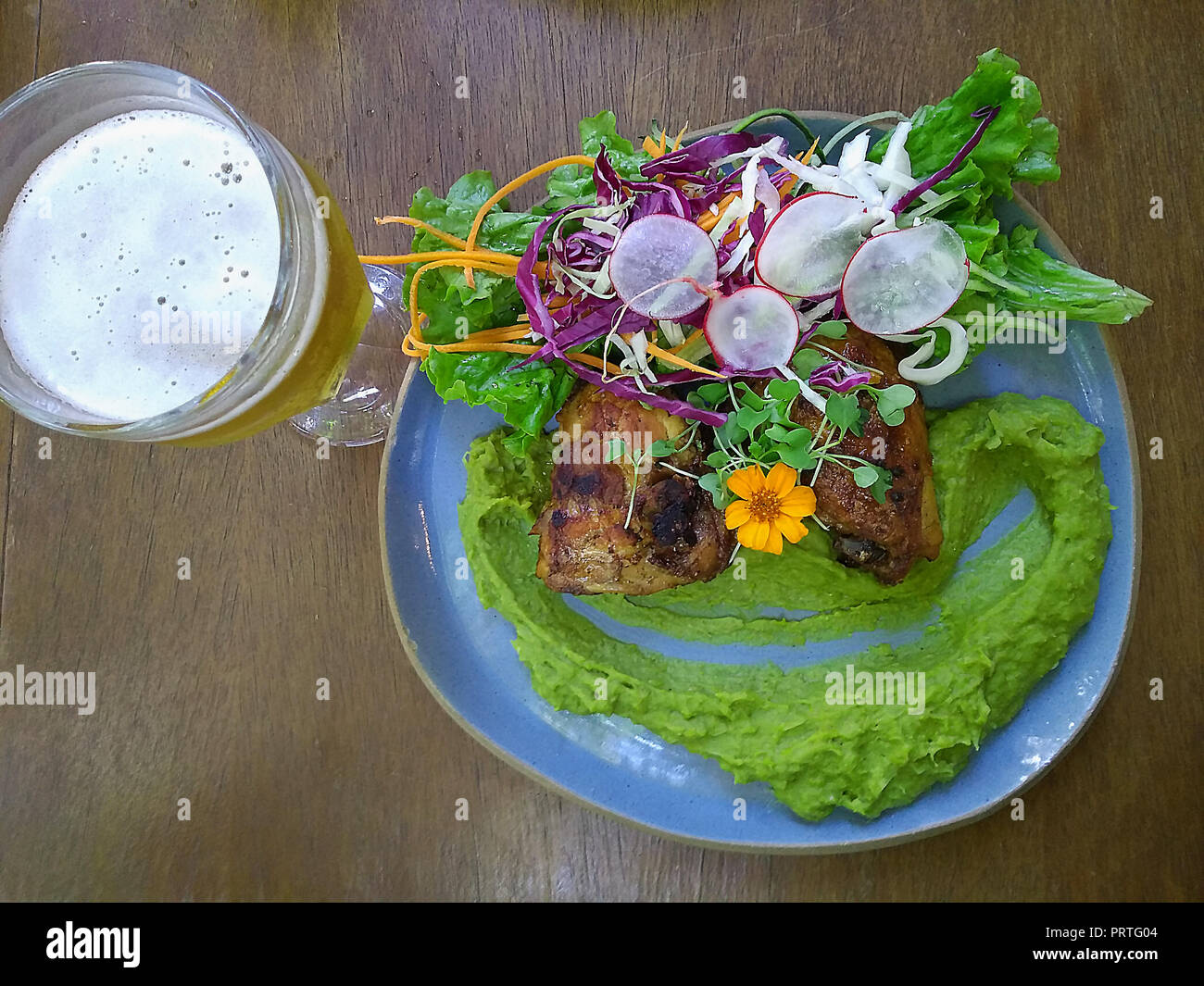 Gourmet chicken dish with pea puree and beer. Lovely chicken dish with ...