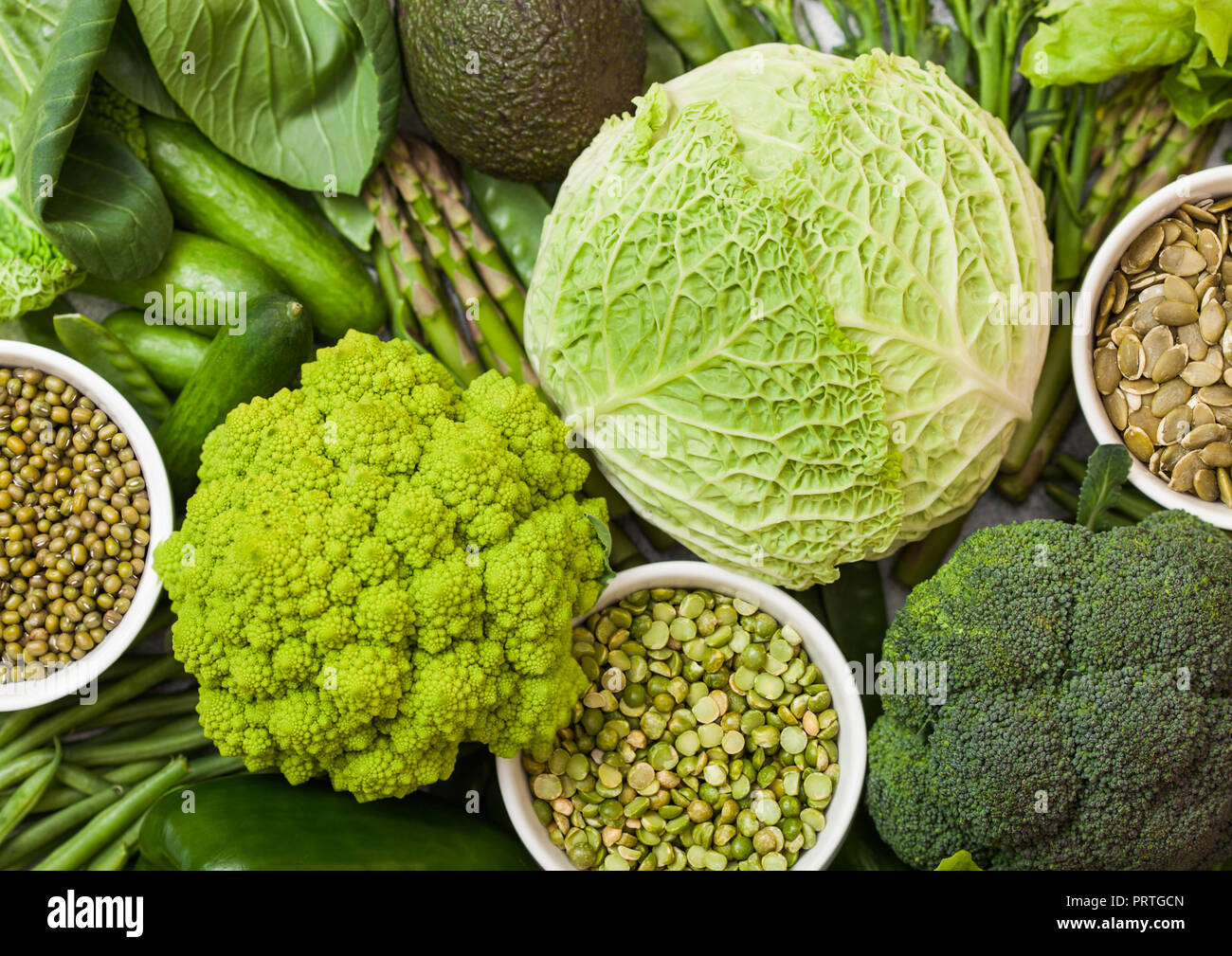 Bowl of mung beans and split peas and pumkin seeds with raw organic ...