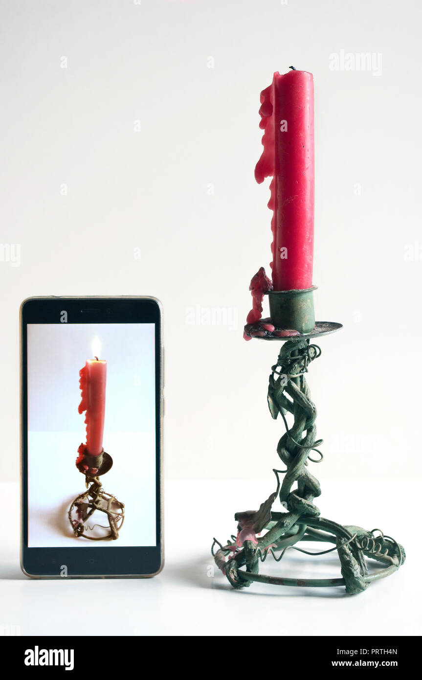 Candle with flame extinguished and ignited Stock Photo - Alamy