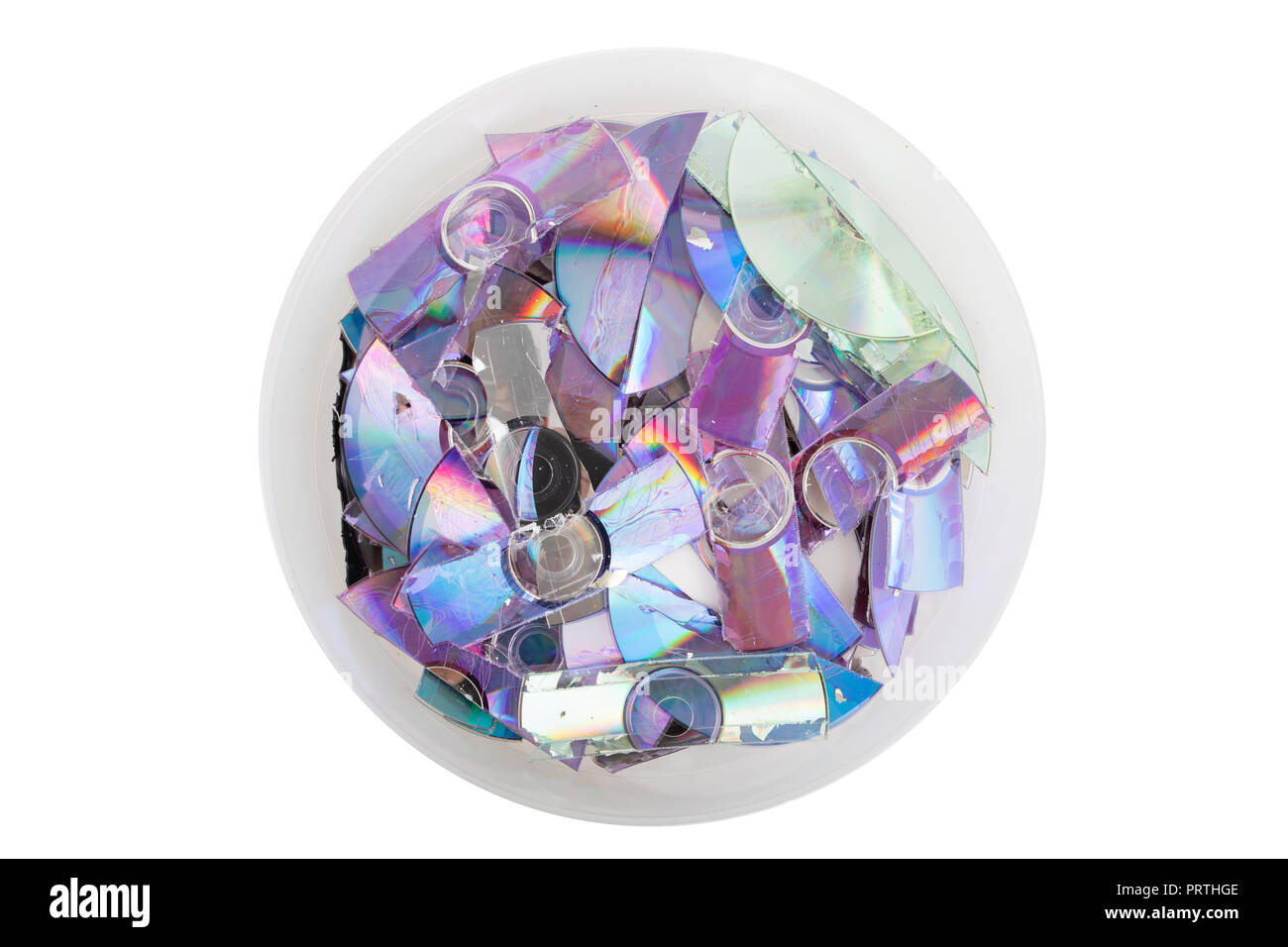 trash with stripes of shredded CD and DVD data disc destroyed by ...