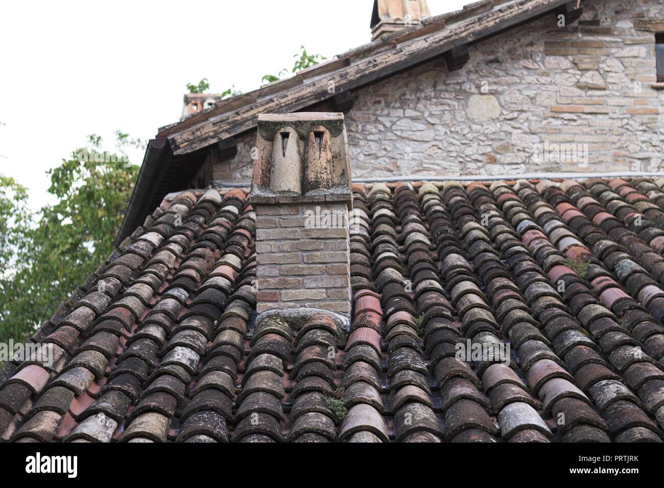 Isolated chimney on the roof of an ancient house (Marche, Italy, Europe ...
