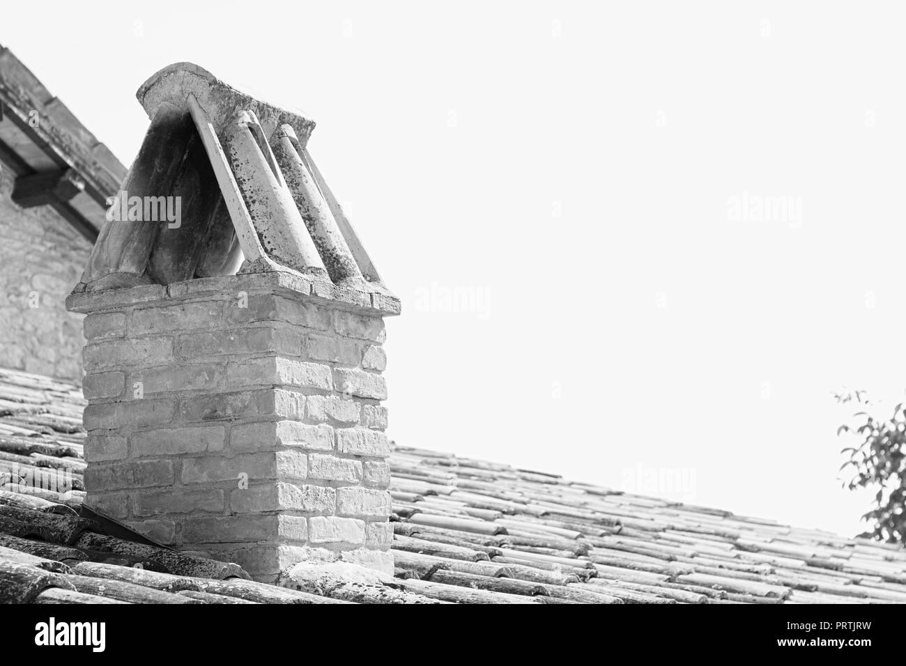 Isolated chimney on the roof of an ancient house (Marche, Italy, Europe ...