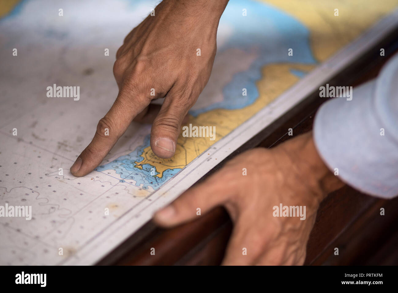 Man reading map Stock Photo - Alamy