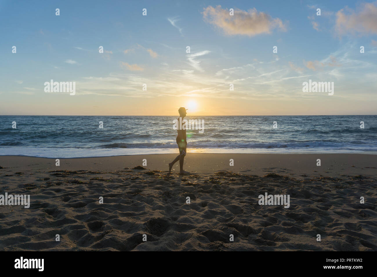 Man walking on sunset hi-res stock photography and images - Alamy
