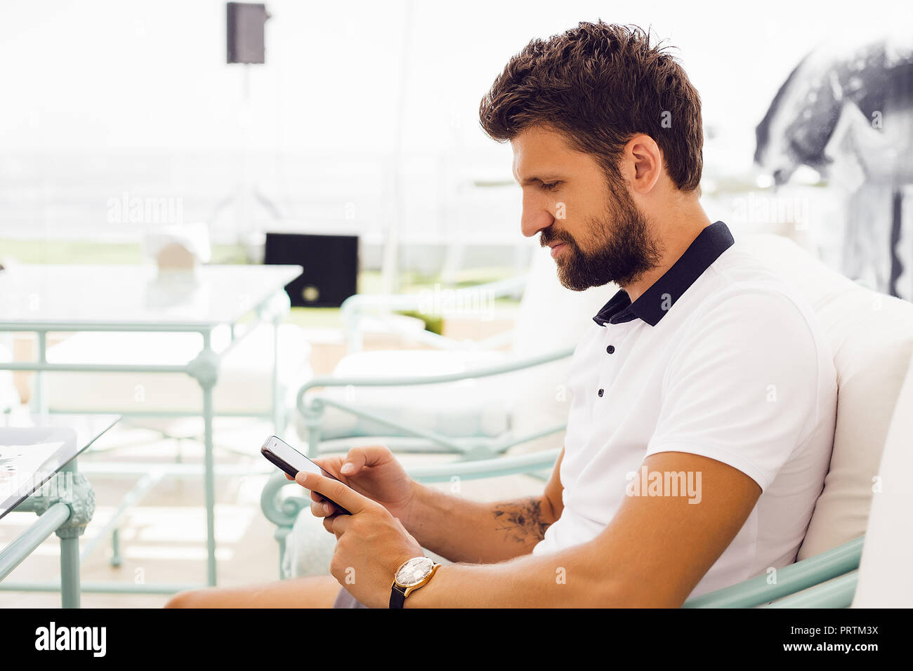 Man sitting on chair social hi-res stock photography and images - Alamy