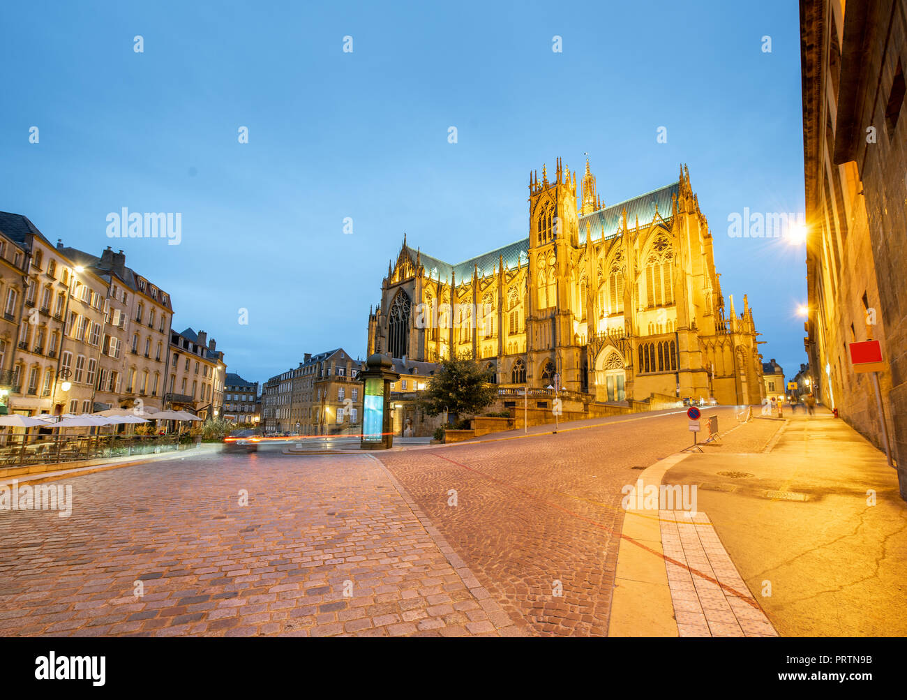 View on the beautiful illuminated cathedral in Metz during the twilight ...