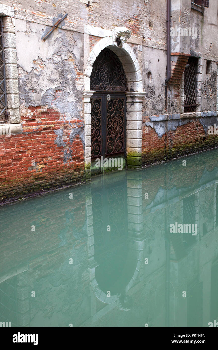 old gate in a Venice canal Stock Photo - Alamy