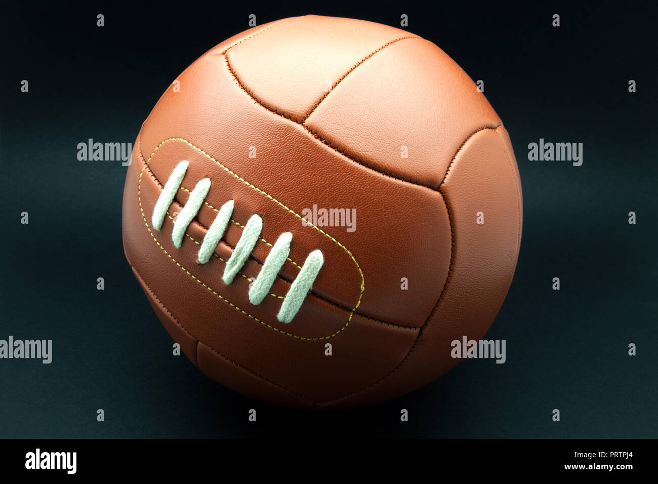 ball of leather on black background Stock Photo - Alamy