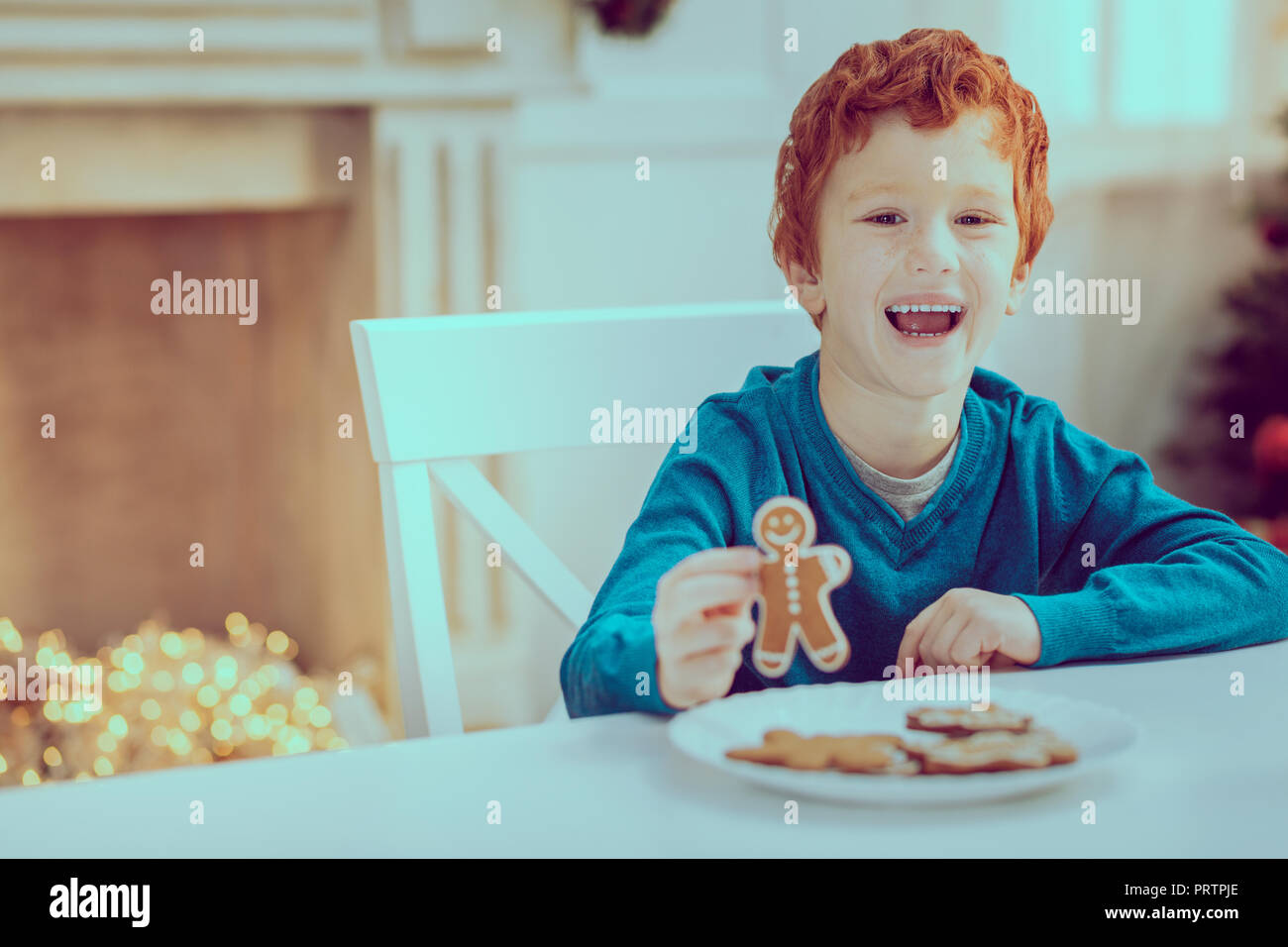 Boy eating biscuits hi-res stock photography and images - Alamy