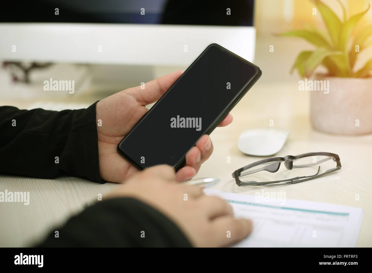 Portrait of filling form with pen. Portrait man showing phone in hand ...