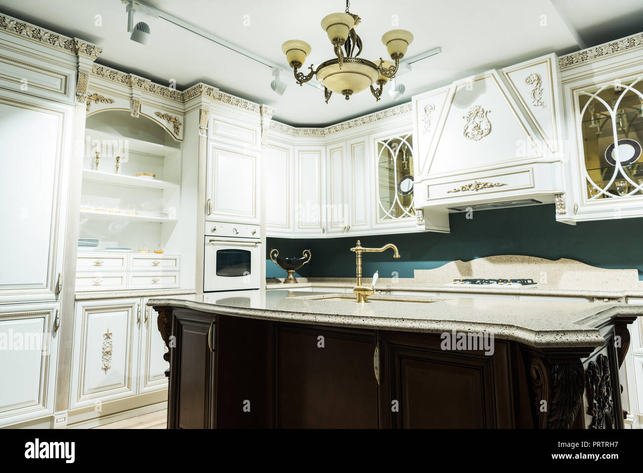 interior of modern white kitchen with comfortable wooden furniture in ...