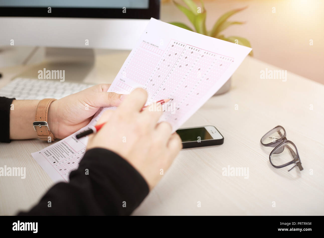 Man is checking Fill OMR sheet with pencil Stock Photo - Alamy