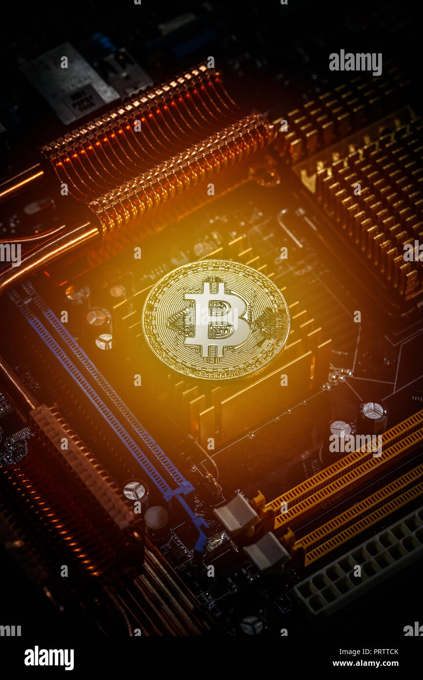 The gold coin of digital crypto currency Bitcoin lies on the ...