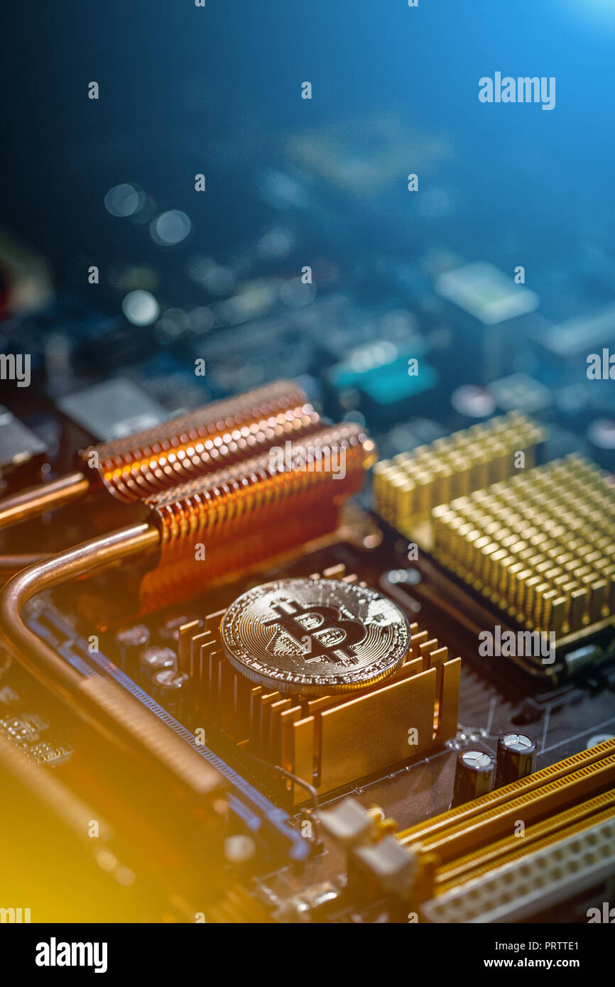 The gold coin of digital crypto currency Bitcoin lies on the ...