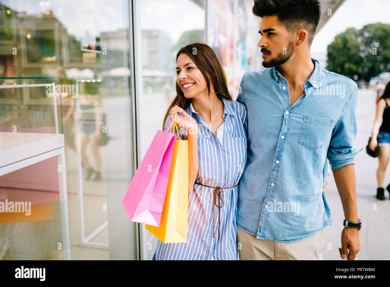 Happy attractive loving couple enjoy shopping together Stock Photo - Alamy