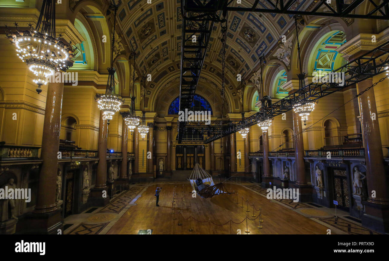 A giant boy figure sleeps in a hammock inside Liverpool's St Georges ...
