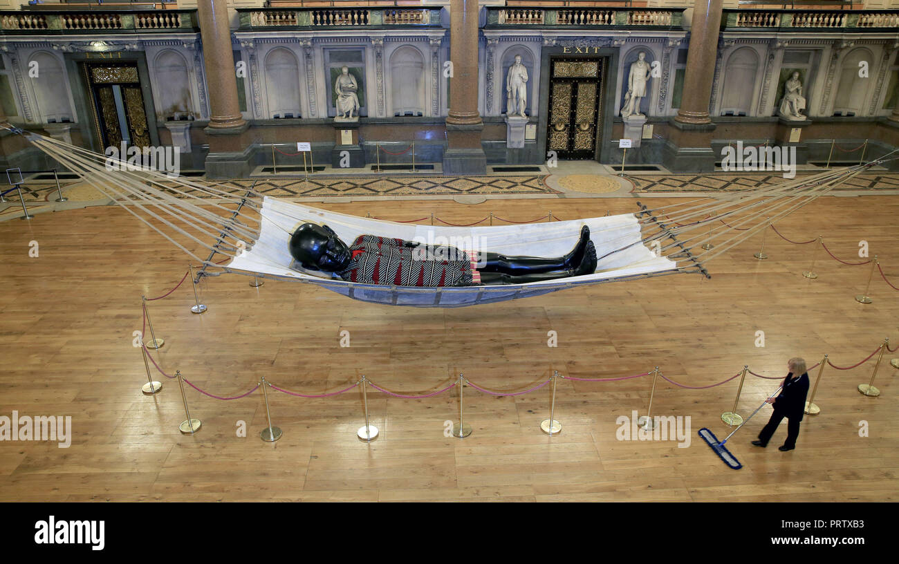 A giant boy figure sleeps in a hammock inside Liverpool's St Georges ...