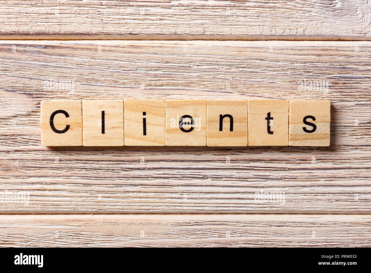 Clients word written on wood block. Clients text on table, concept ...