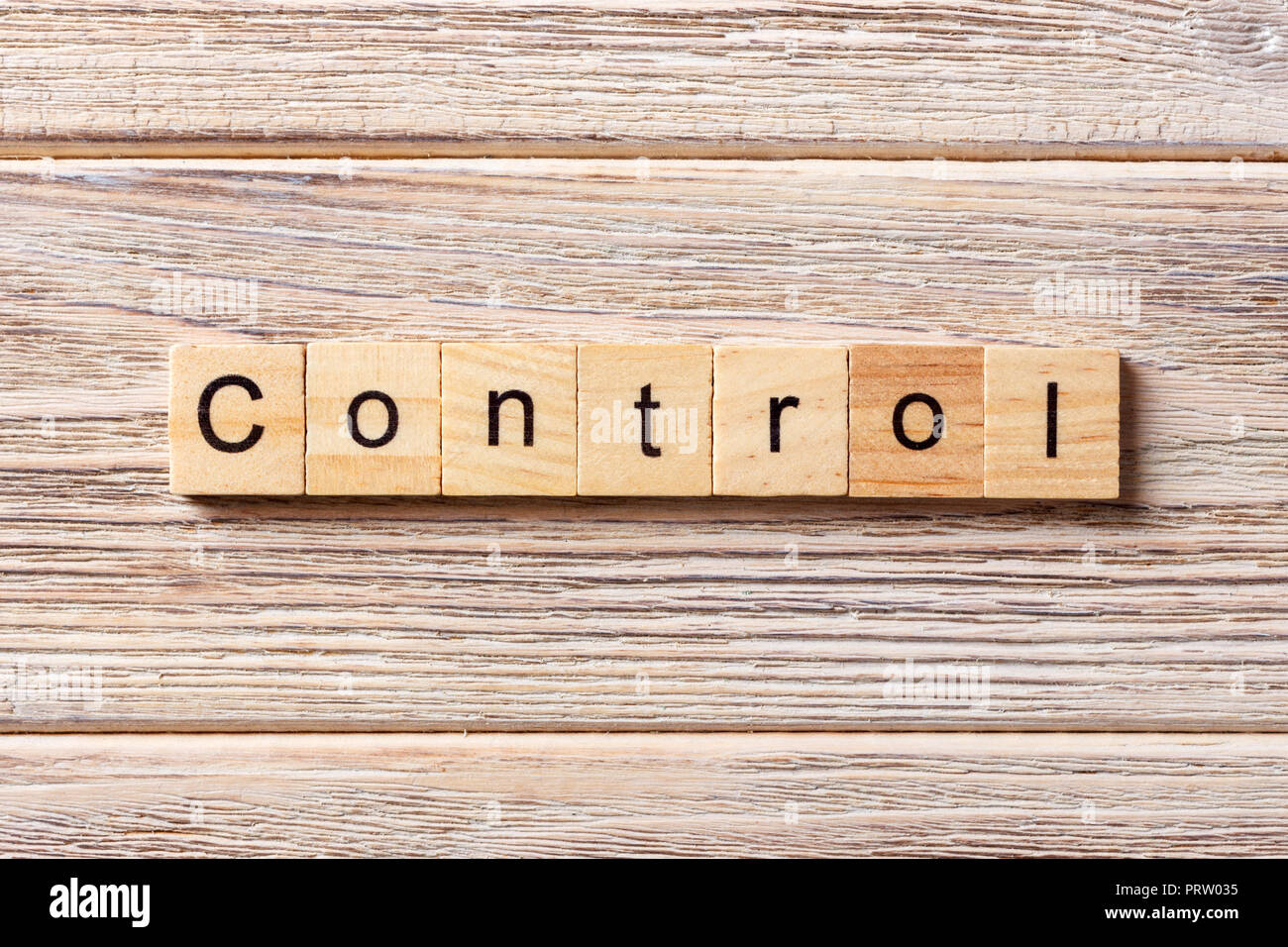 control word written on wood block. control text on table, concept ...