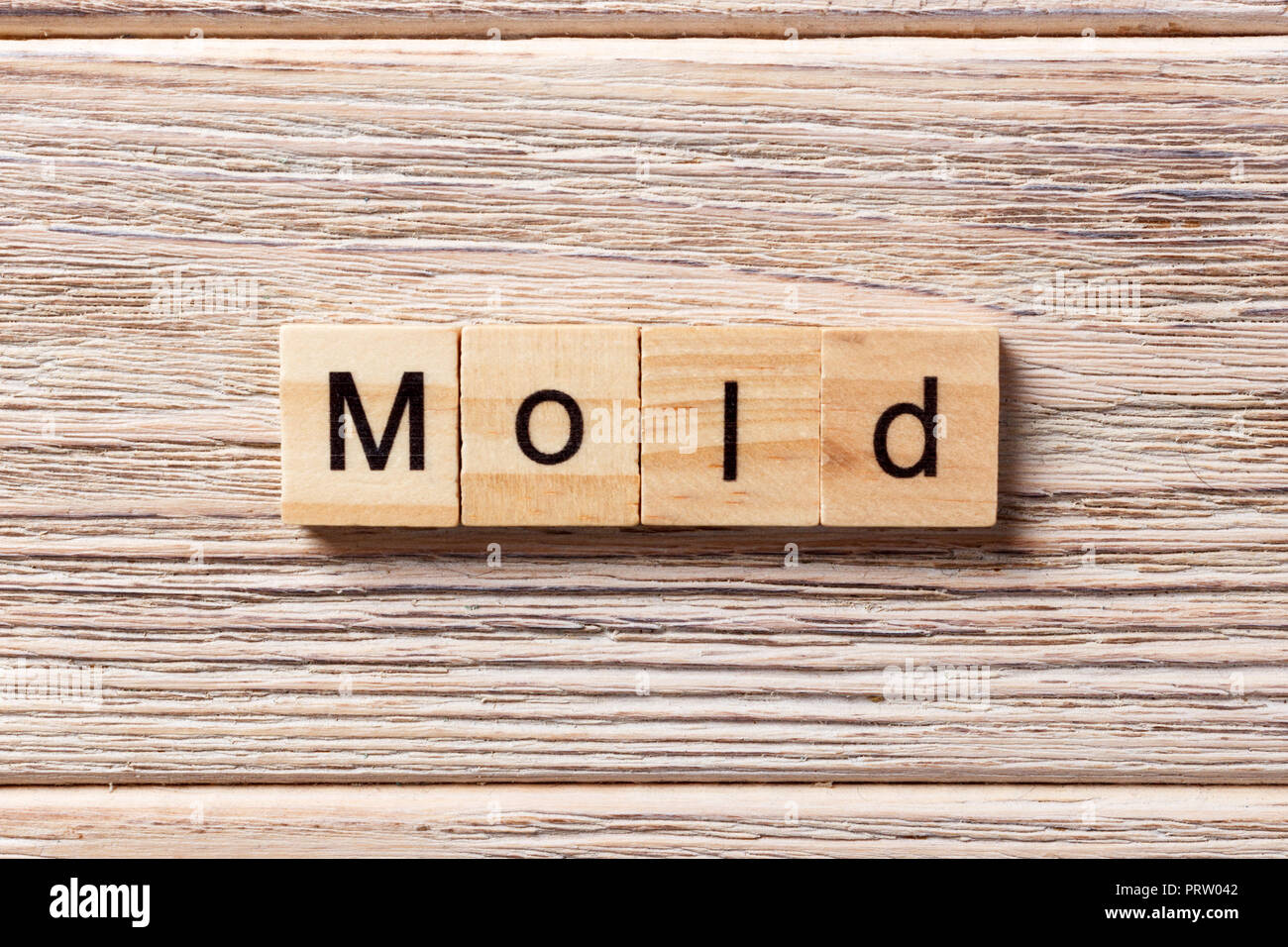 Mold word written on wood block. Mold text on table, concept Stock ...