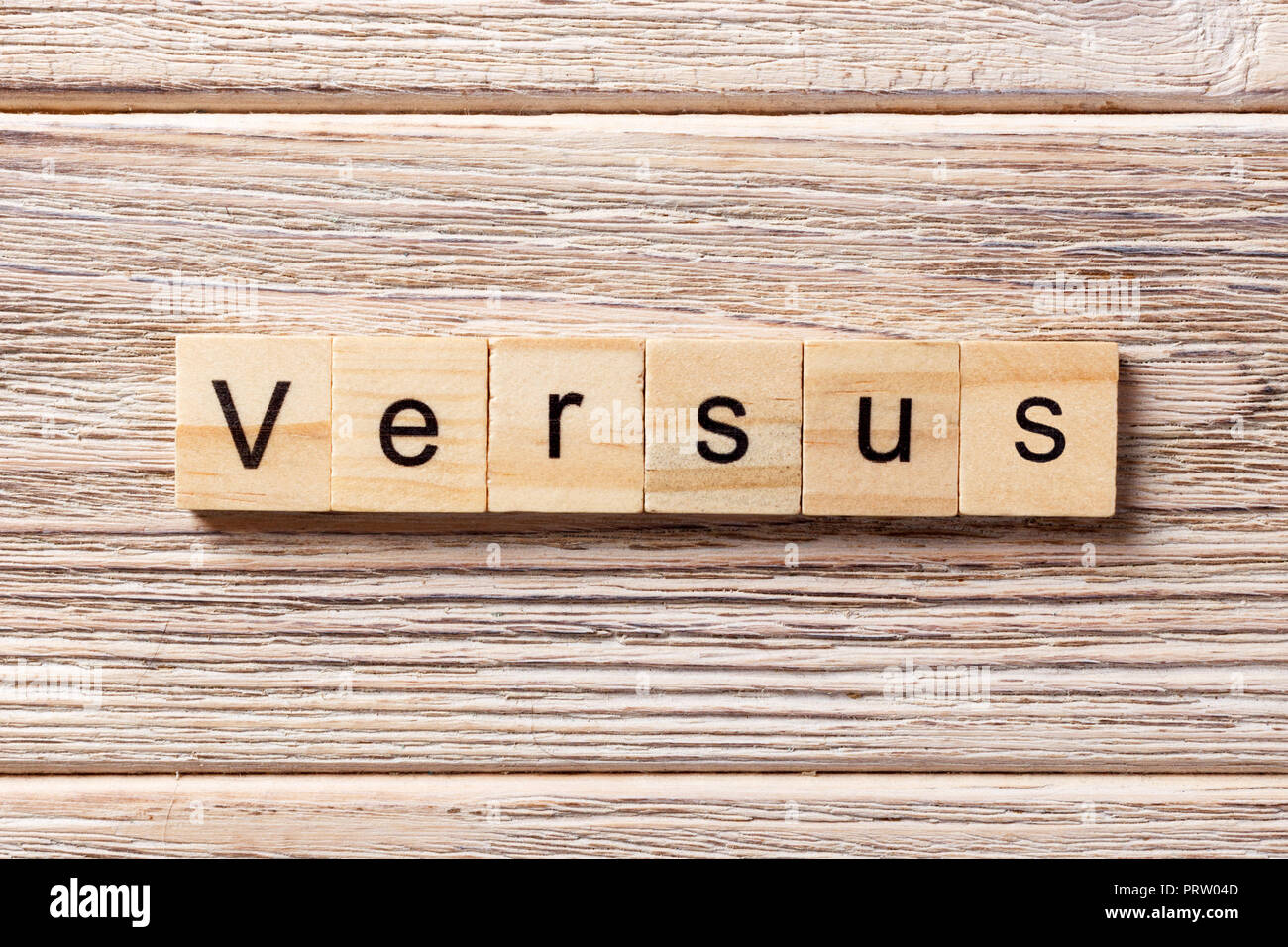 Versus word written on wood block. Versus text on table, concept Stock ...