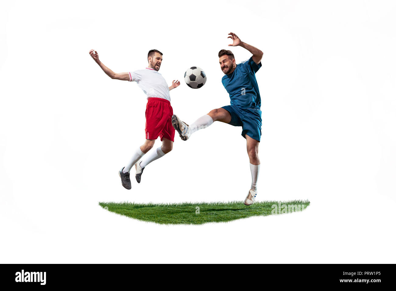 Football players tackling for the ball over white background ...