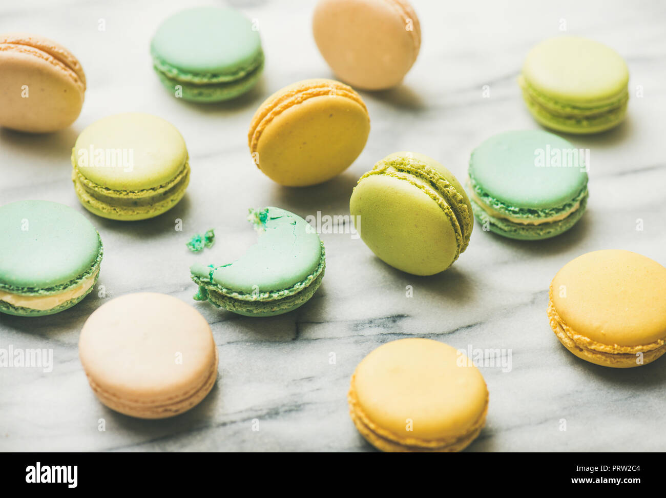 Colorful French macaroons over grey marble background Stock Photo - Alamy
