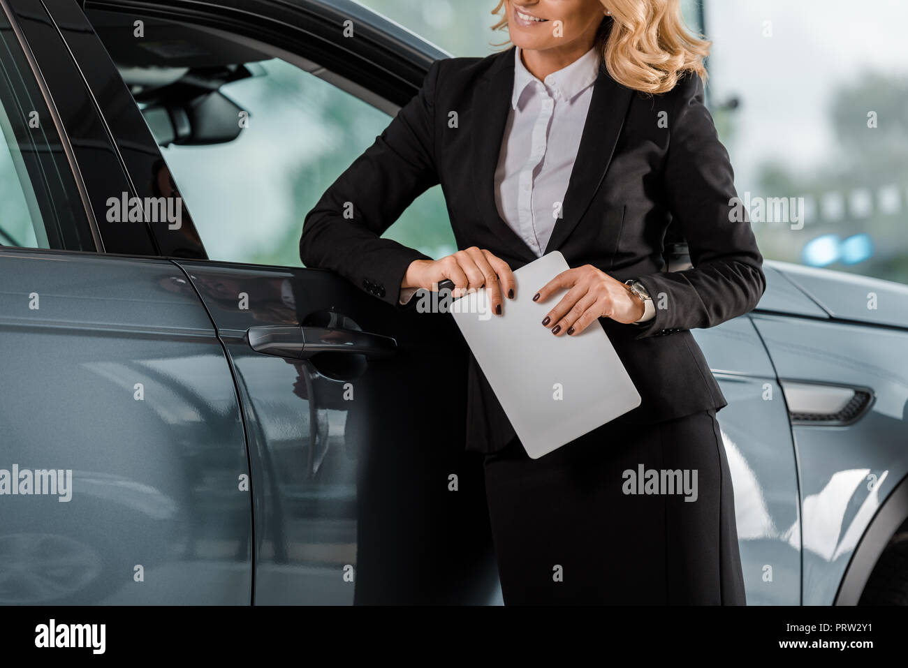 Successful car dealership manager tablet hi-res stock photography and ...