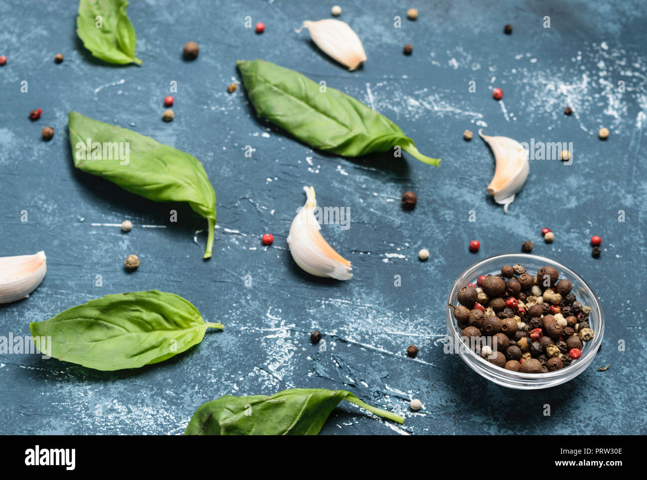 Cooking ingredients - basil leaves,garlic, pepper. Concrete grunge ...