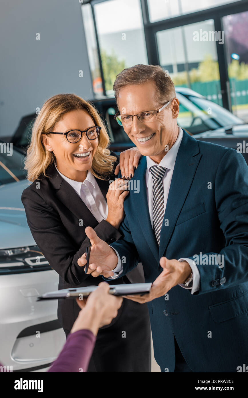 Signing papers at dealership hi-res stock photography and images - Alamy