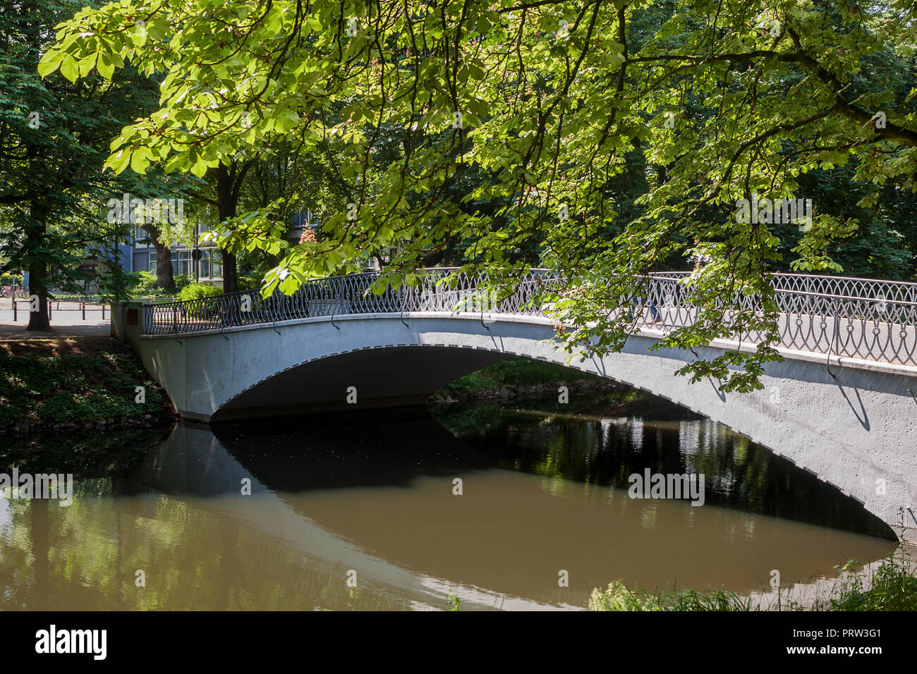 Beautiful park scene in public park with lawn trees water and ...