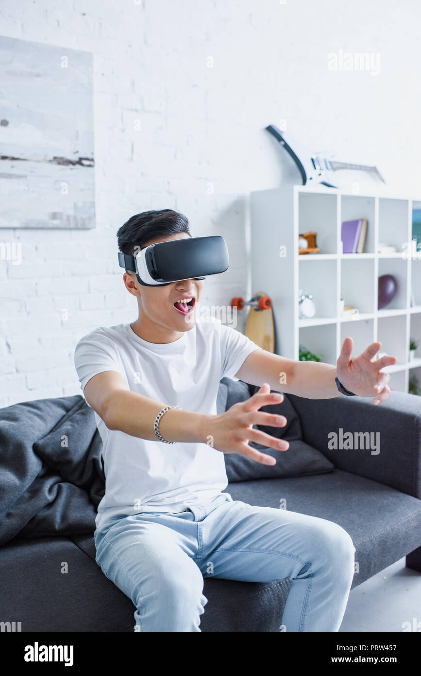 Man sitting using vr hi-res stock photography and images - Alamy