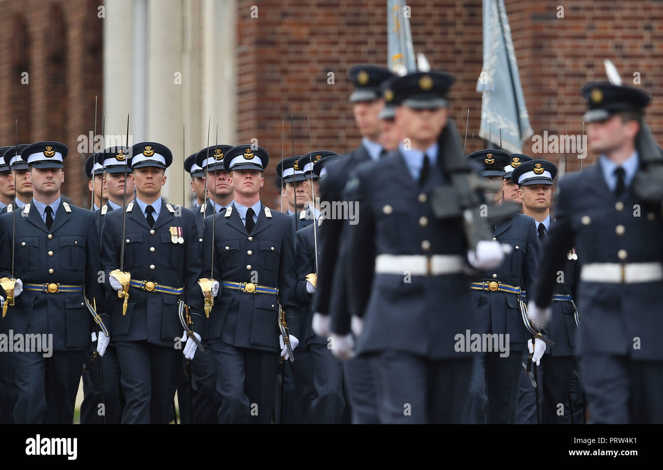 Airmen(right) and officers (left) parade during a joint graduation at ...