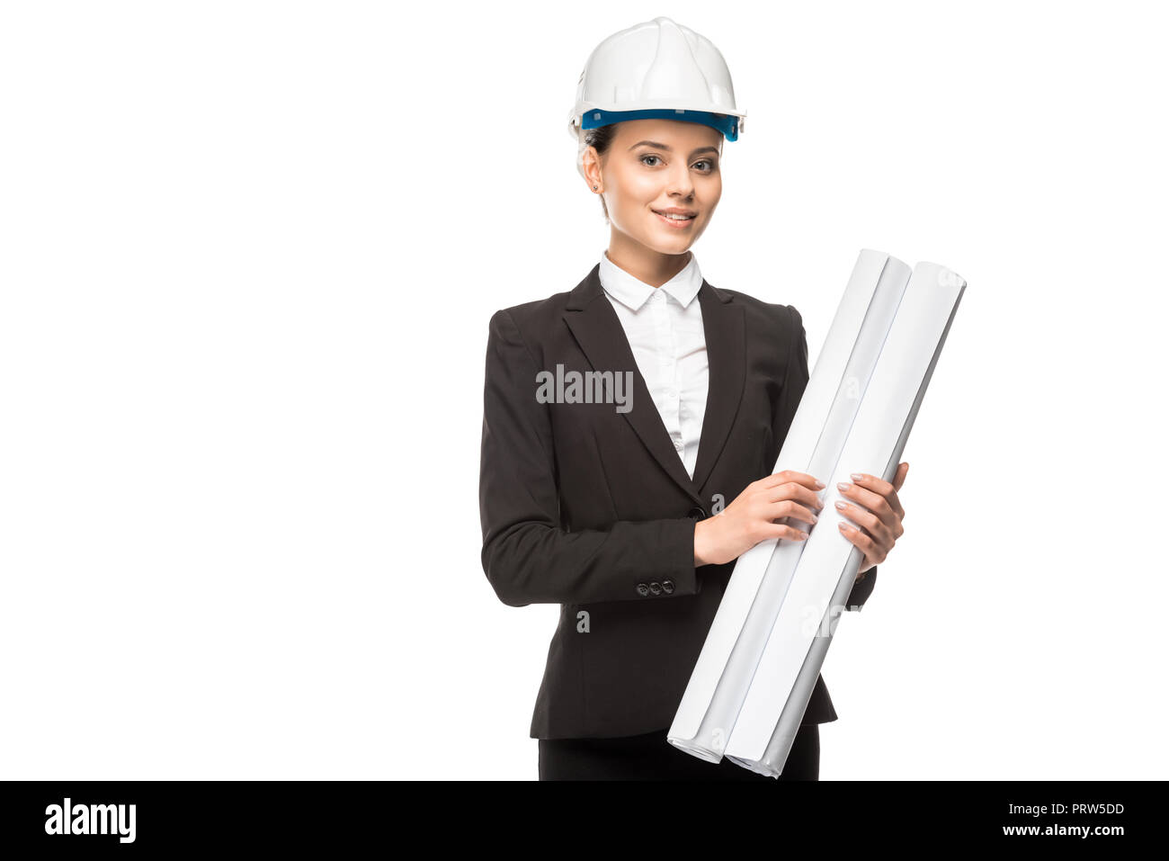happy young female architect in helmet and suit holding blueprints and ...