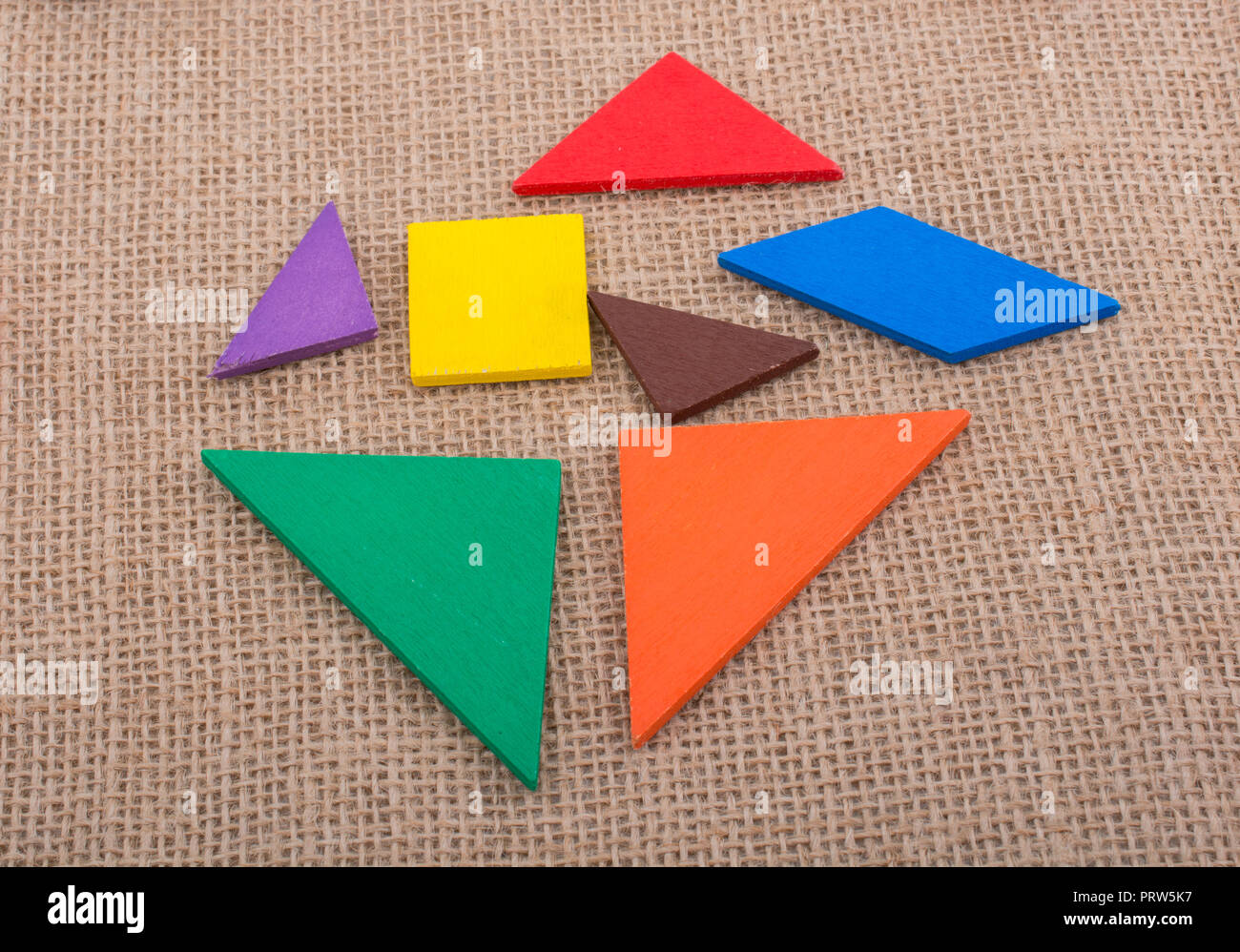 Colorful pieces of a square tangram puzzle Stock Photo - Alamy