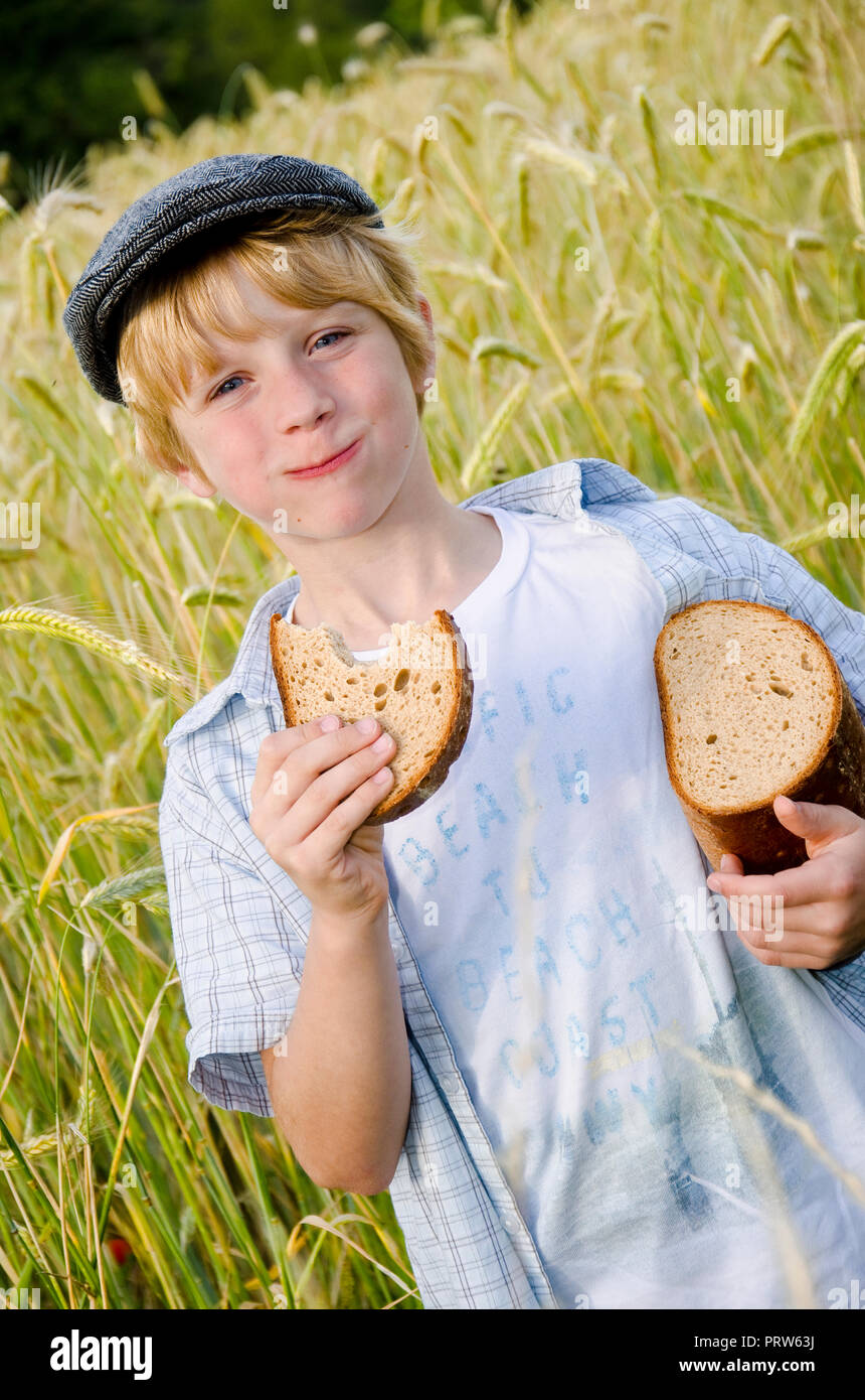 Child young boy eating bakery hi-res stock photography and images - Alamy
