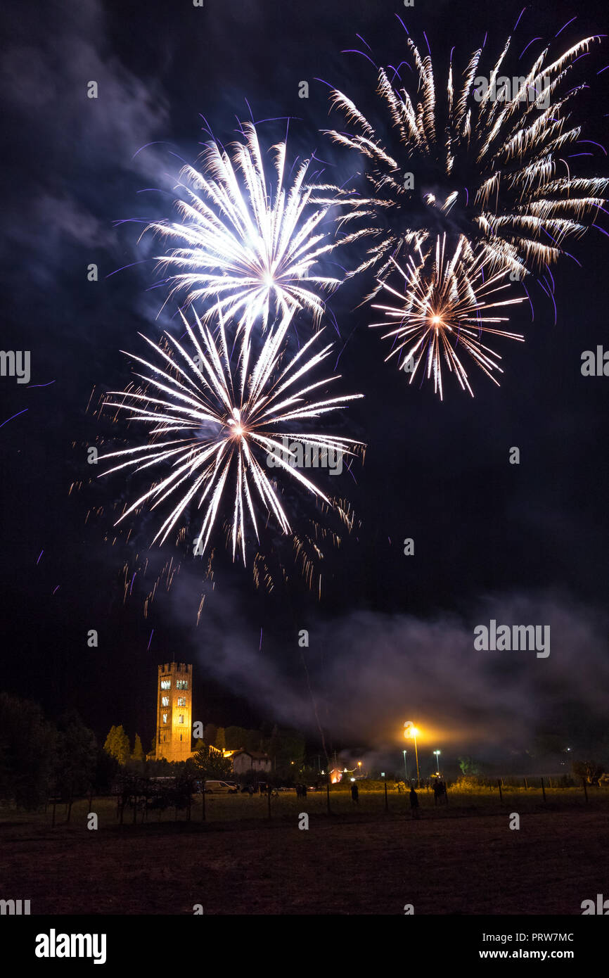Firework show over church in Italy Stock Photo - Alamy