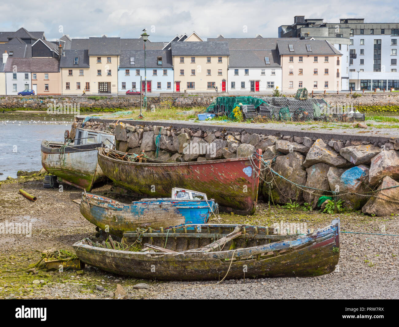 A boat graveyard next to River Corrib the Claddagh area of Galway in ...