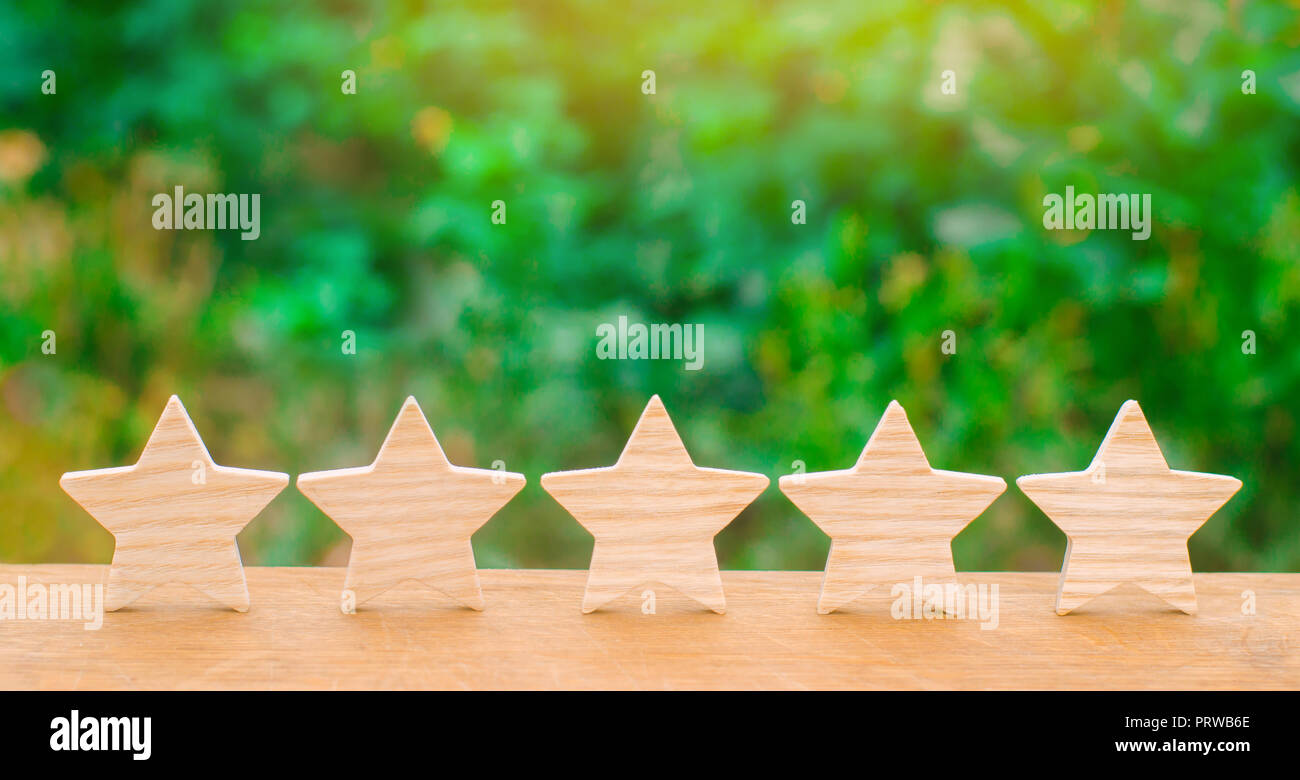 Five wooden stars. Get the fifth star. The concept of the rating of ...