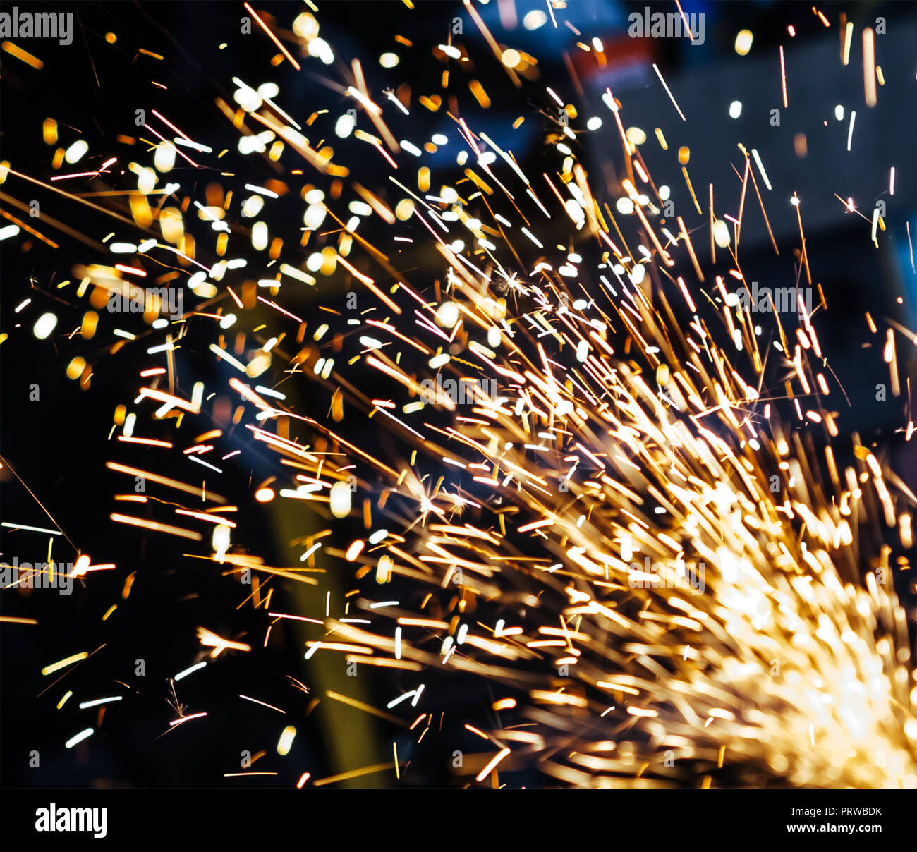 Magic glowing Flow of Sparks in the Dark background Stock Photo - Alamy