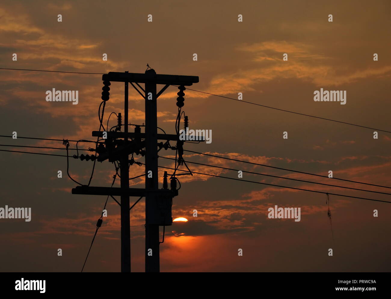 high voltage electric pole on sunset Stock Photo - Alamy