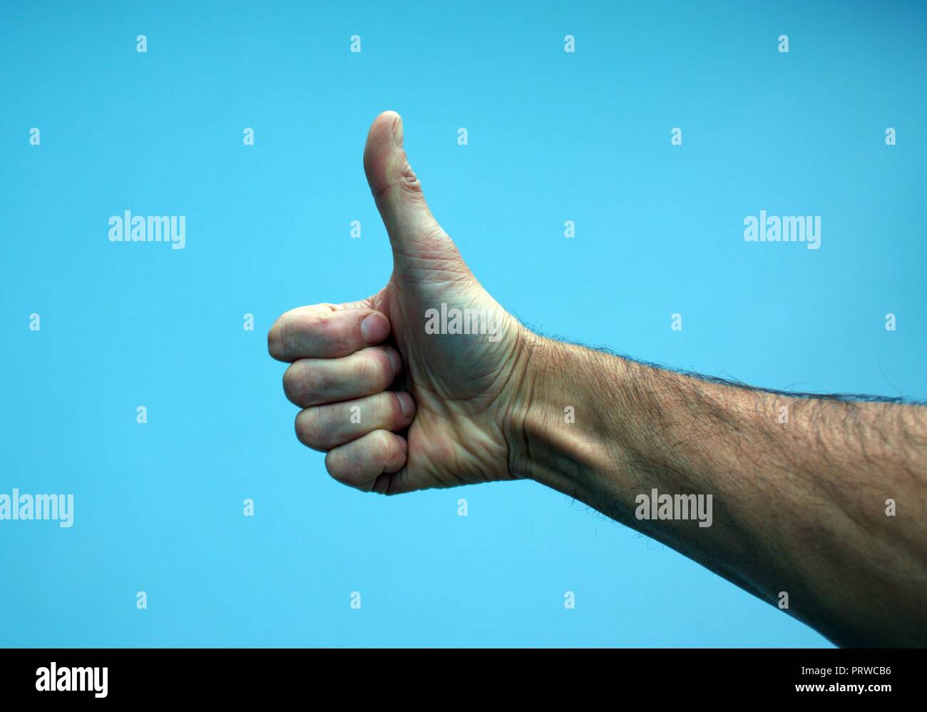 Thumbs up sign made by mans hand Stock Photo - Alamy