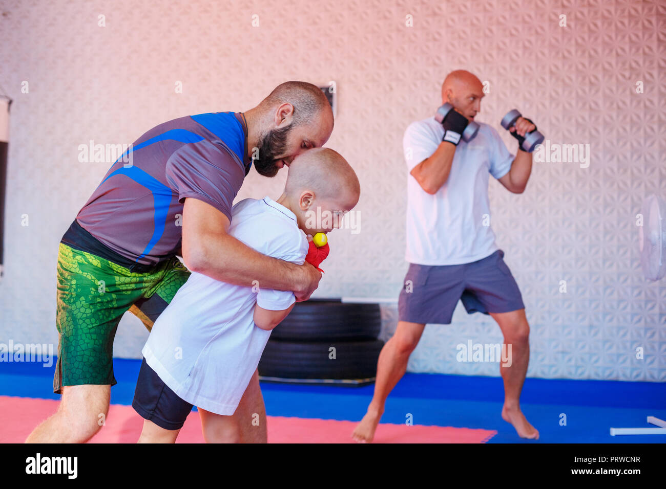 the coach teaches the boy kick Boxing Stock Photo - Alamy