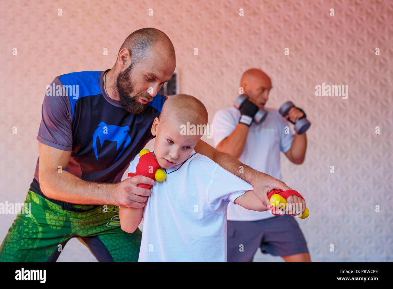 the coach teaches the boy kick Boxing Stock Photo - Alamy