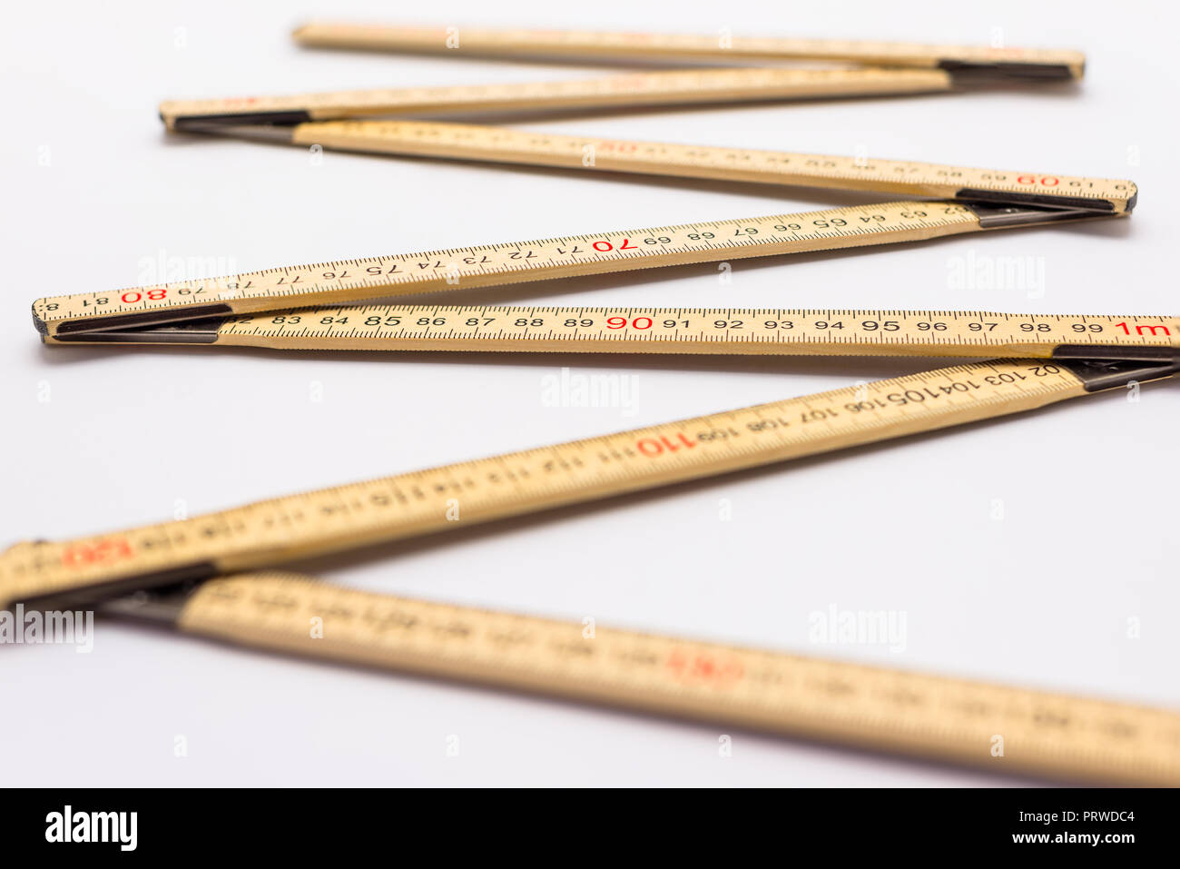 Wooden folding ruler isolated on a white background Stock Photo - Alamy