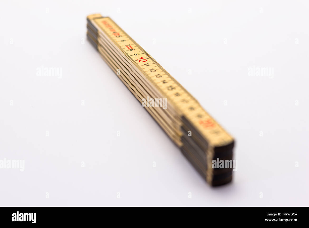 Wooden folding ruler isolated on a white background Stock Photo - Alamy