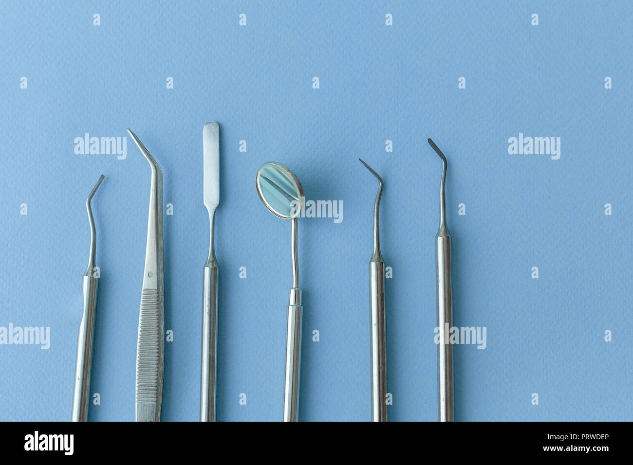 Professional Dentist tools in dental office: dentist mirror, forceps ...