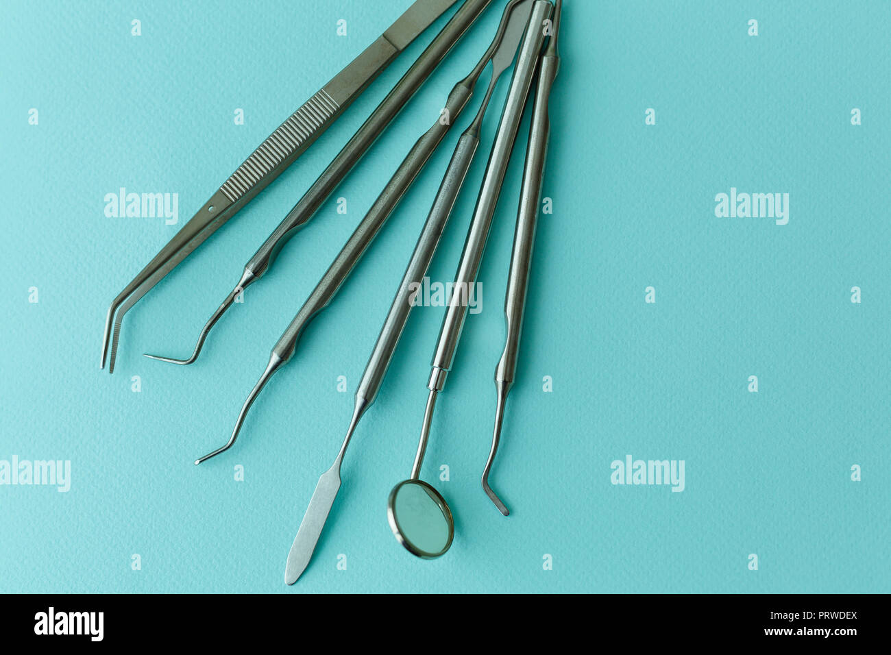 Professional Dentist tools in dental office: dentist mirror, forceps ...